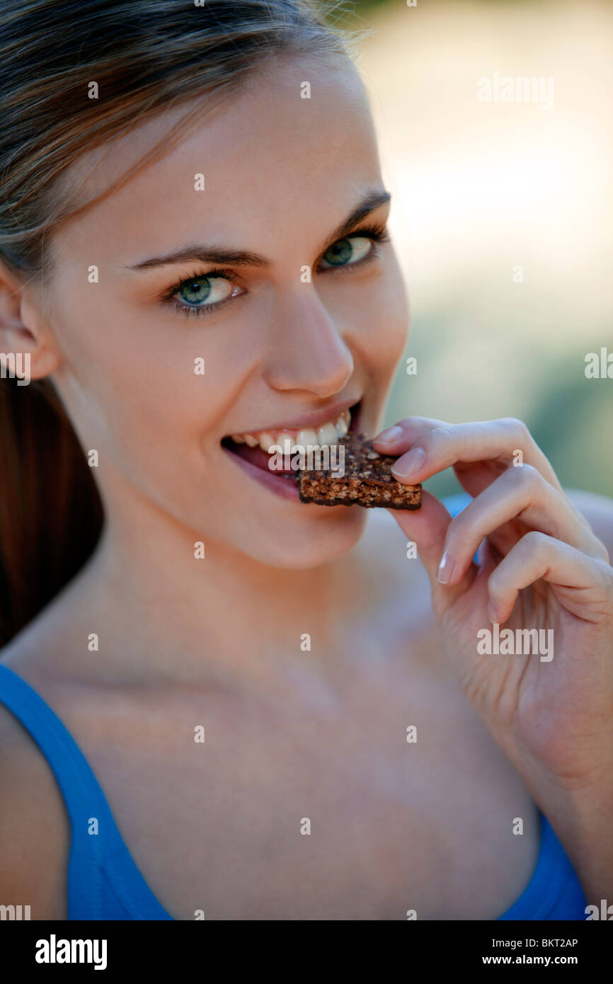 girl eating a snack Stock Photo - Alamy
