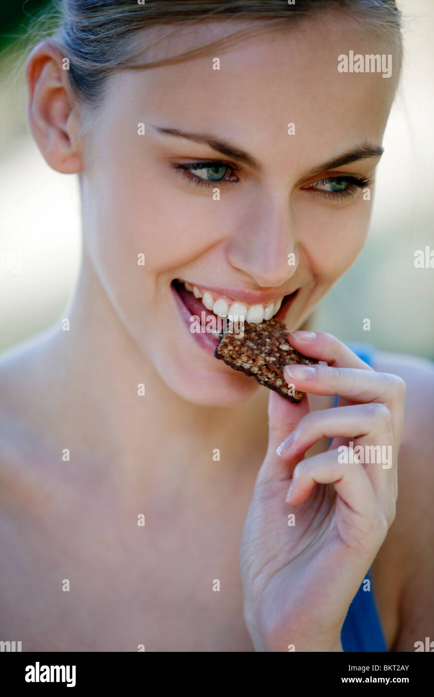 girl eating a snack Stock Photo - Alamy