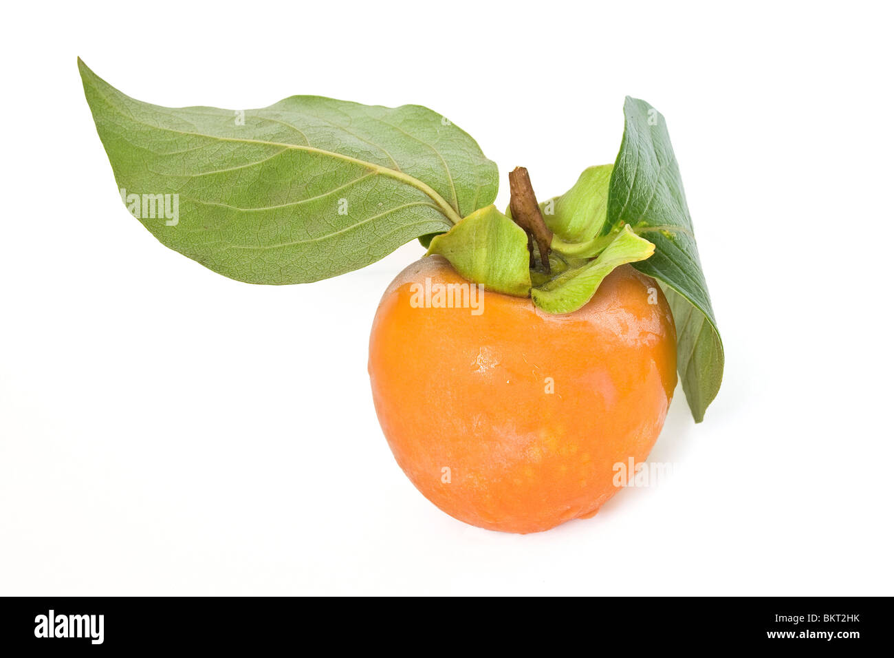 one ripe persimmon isolated on white background Stock Photo - Alamy
