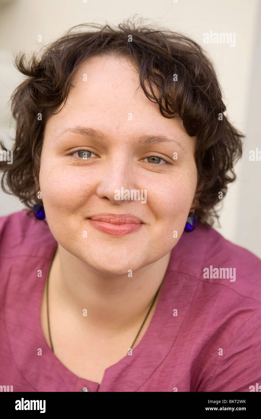 smiling curl woman Stock Photo - Alamy