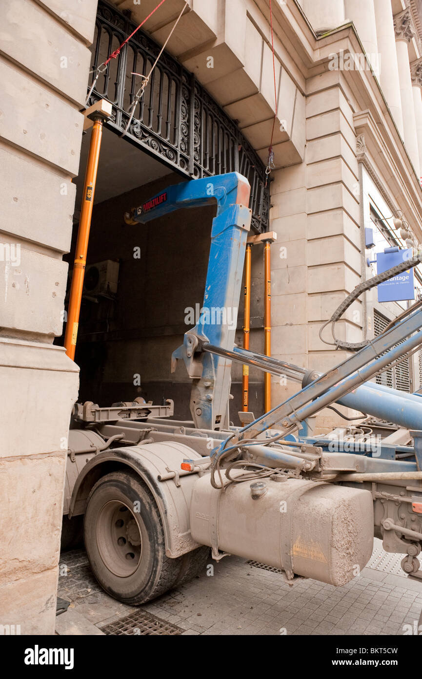 Skip Lorry arm stuck under archway Stock Photo - Alamy