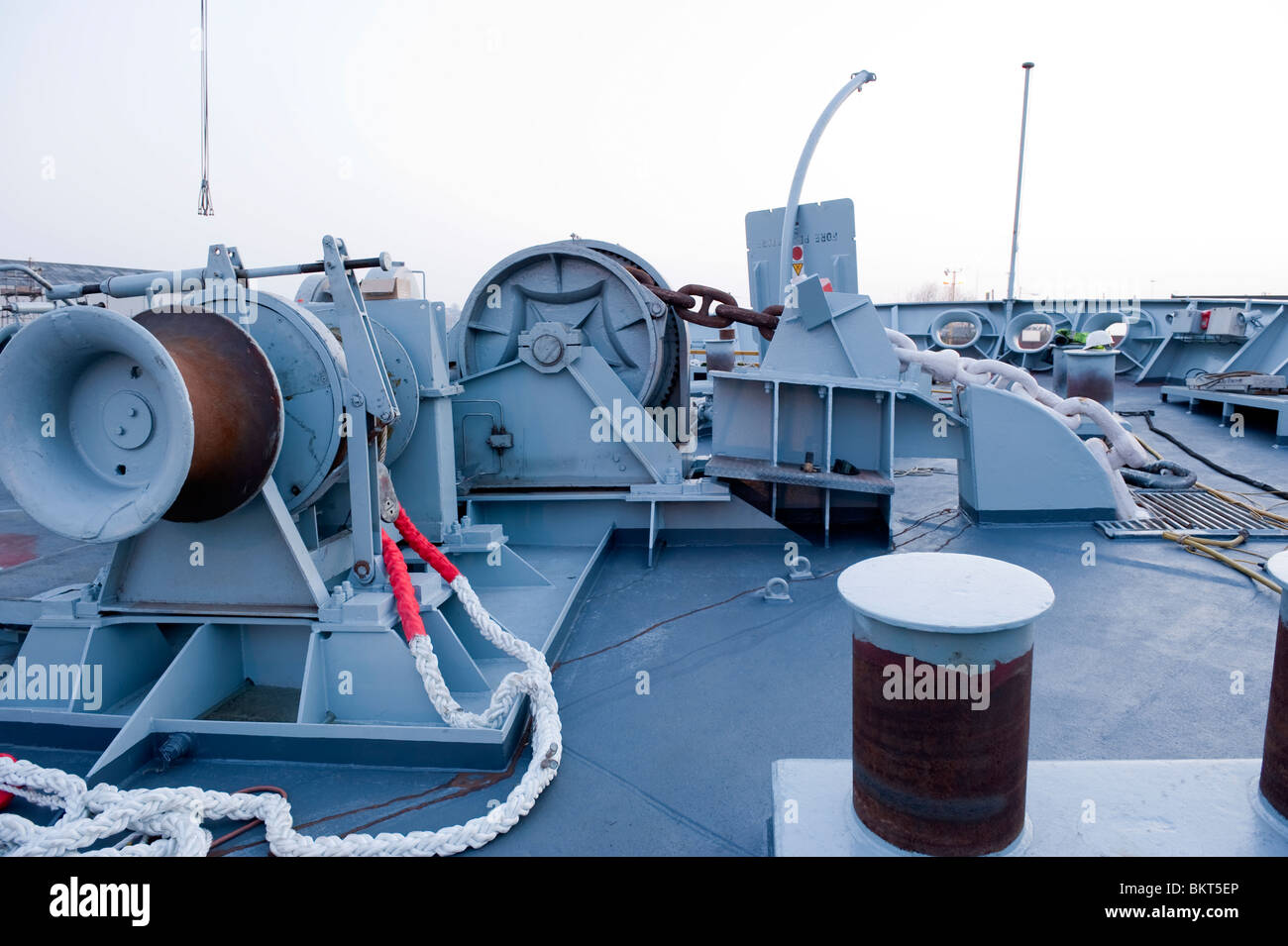 Deck of a ship showing winding gear for rope and anchor chain Stock ...