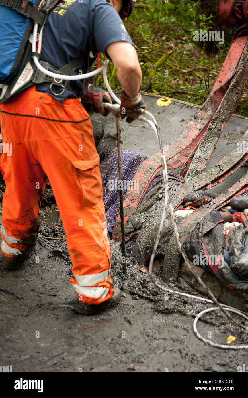 Firemen rescuing horse stuck in mud using sand air lance Stock Photo ...