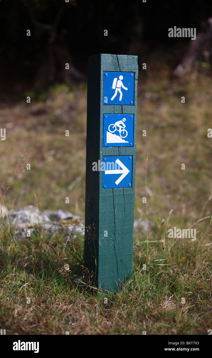 A Department of Conservation sign for a walking track and mountain bike ...