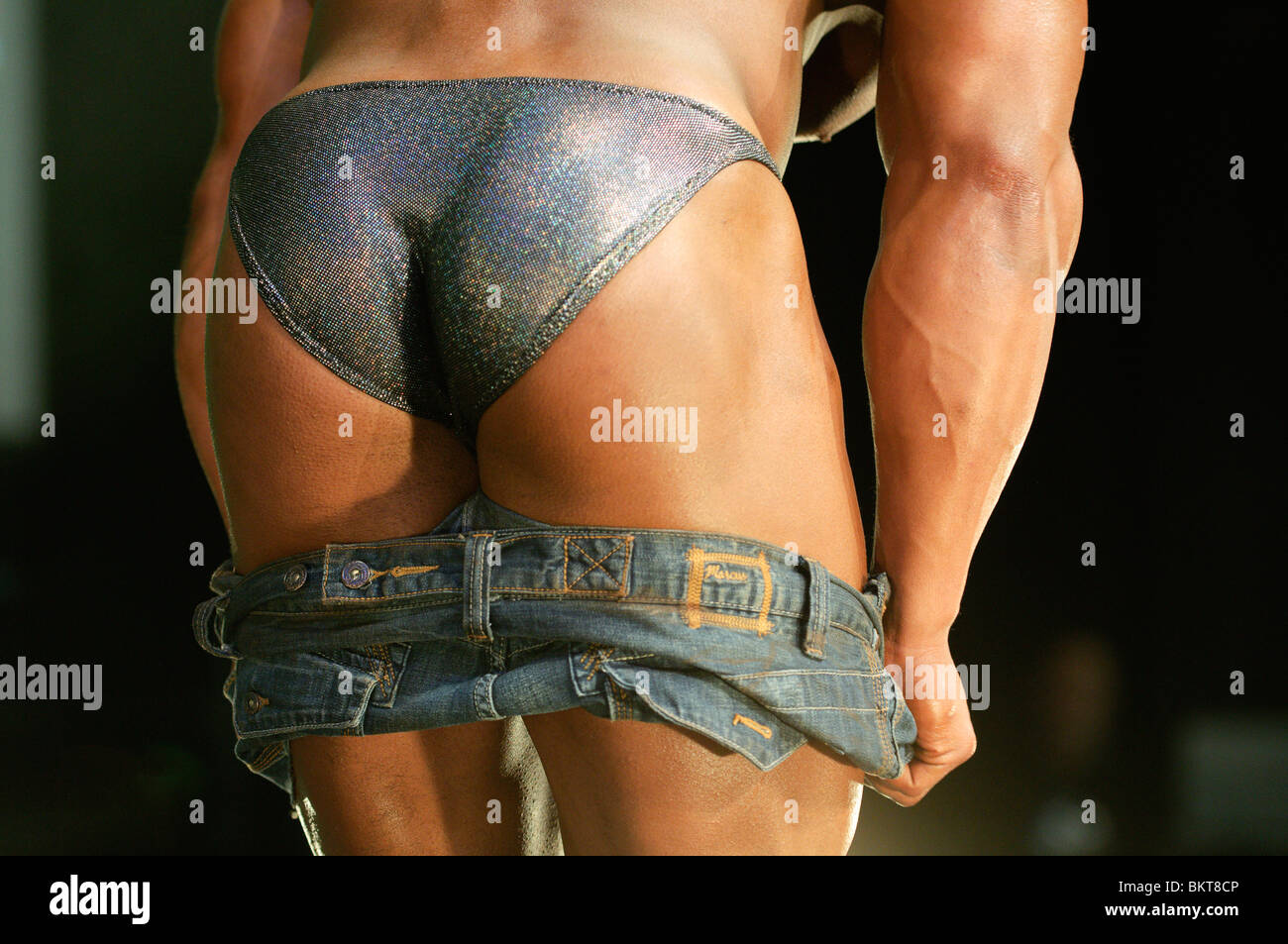 strong man pulls down his short pants Stock Photo - Alamy