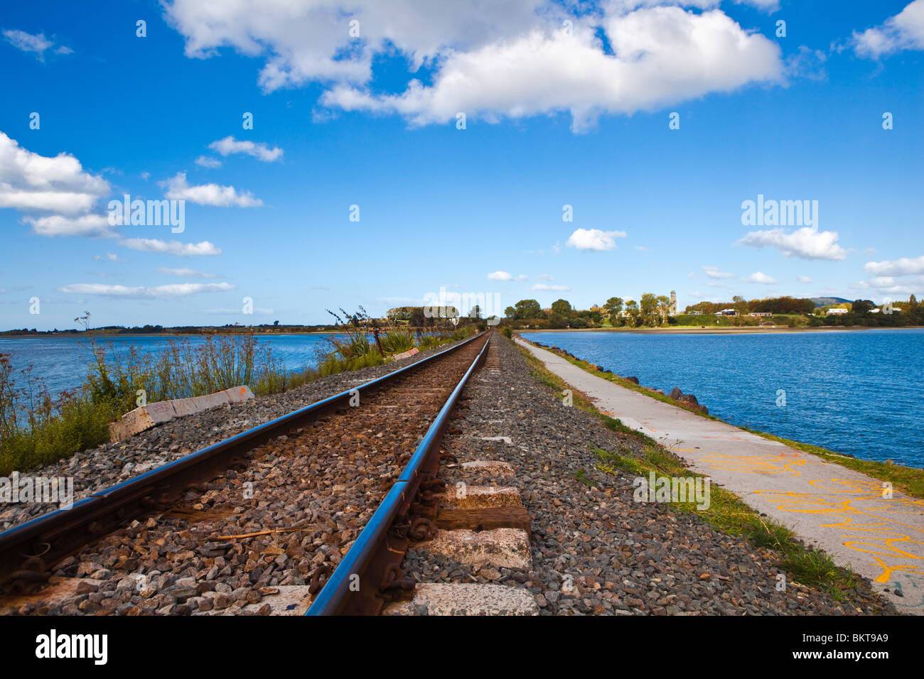 A railway line and footpath Stock Photo - Alamy