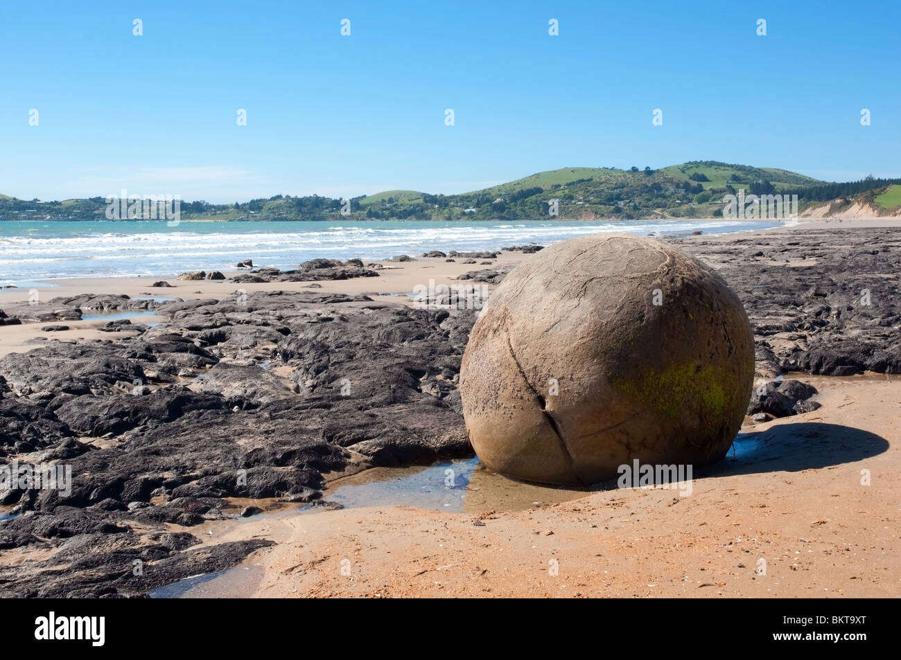 The Moeraki Boulders are large spherical boulders lying along a stretch ...