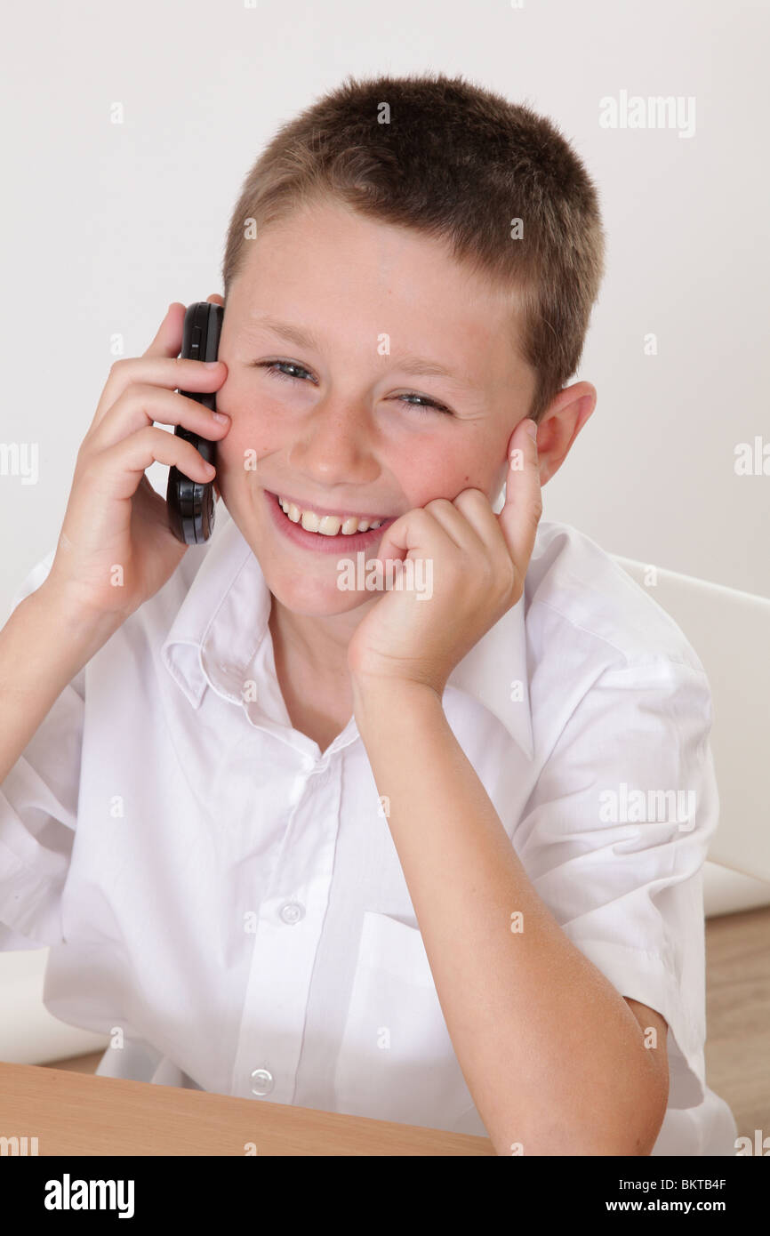 Young boy on a mobile phone Stock Photo - Alamy