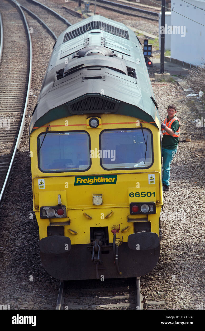 Train driving getting back into cab of locomotive at the East Suffolk ...