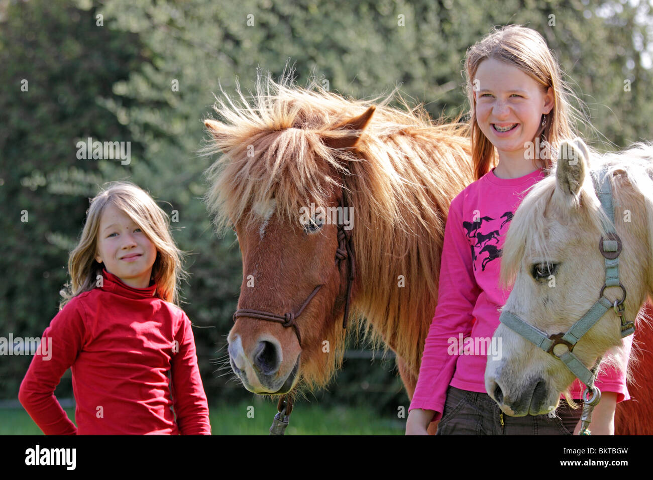 Young girl with ponies hi-res stock photography and images - Alamy
