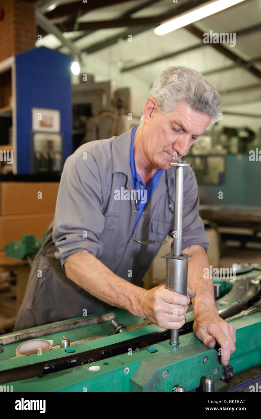 senior worker on factory floor in the manufacturing industry Stock ...