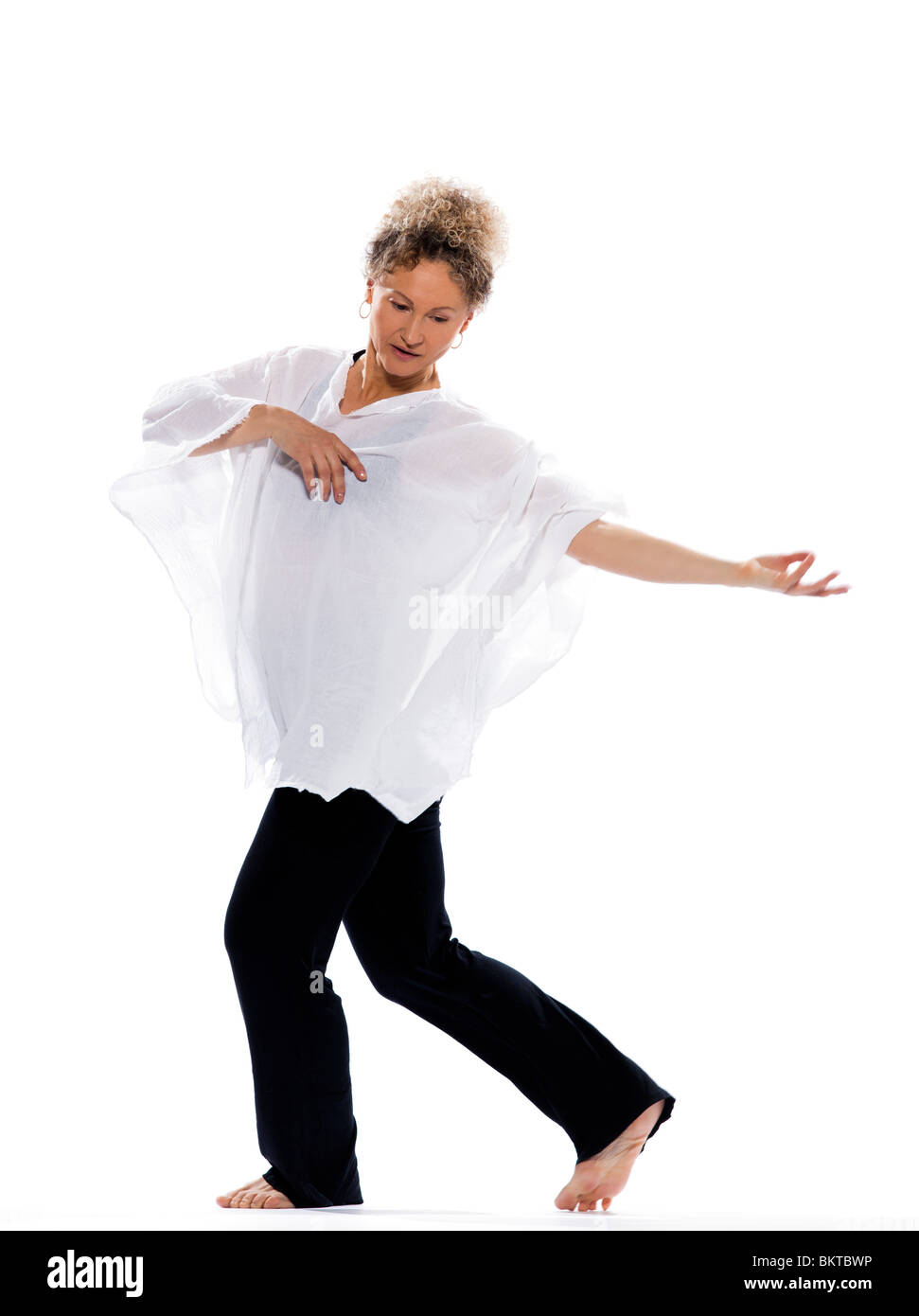 beautiful mature woman dancing modern ballet on isolated white ...
