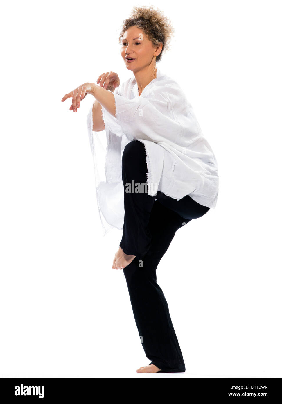 beautiful mature woman dancing modern ballet on isolated white ...