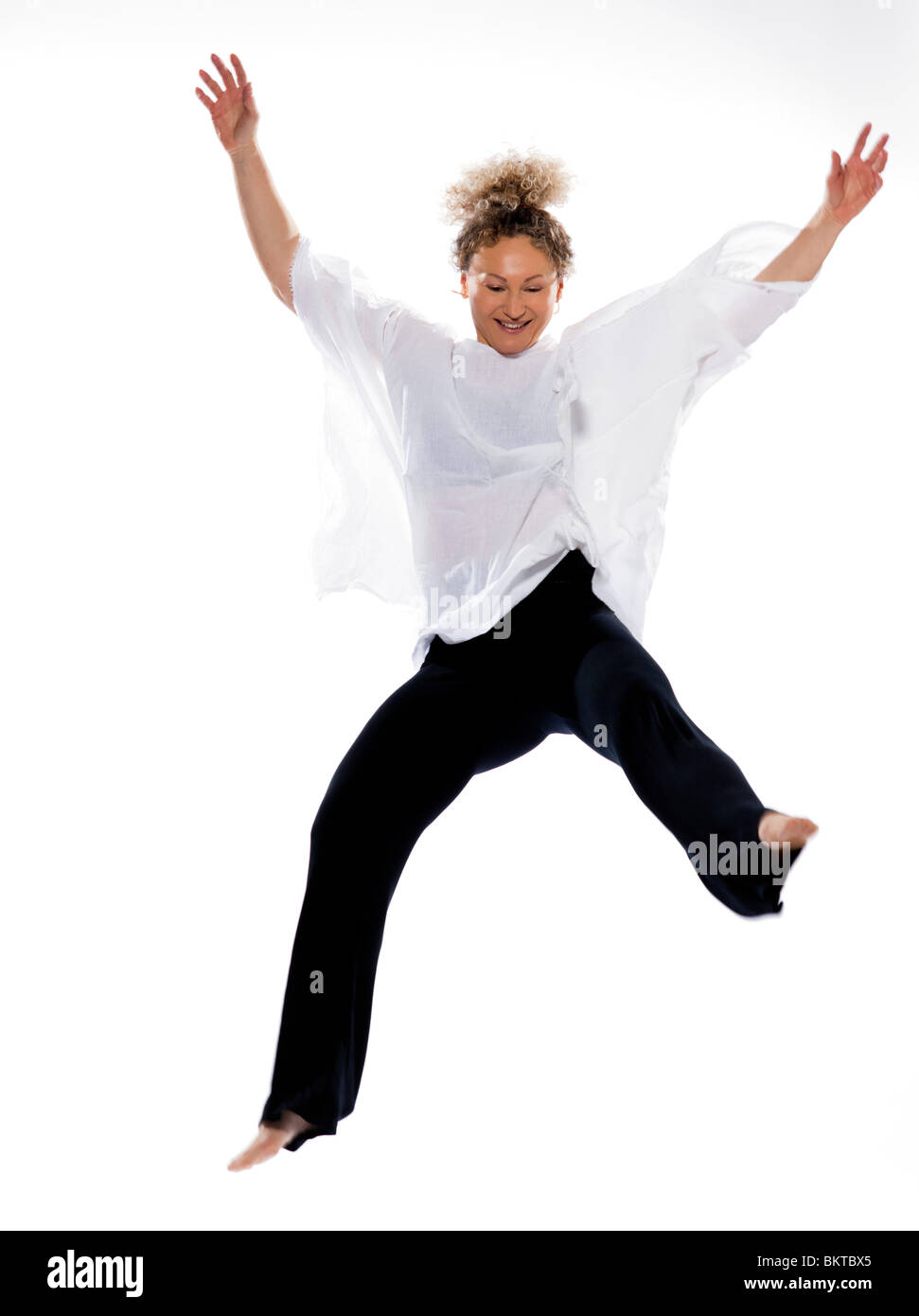 beautiful mature woman dancing modern ballet on isolated white ...