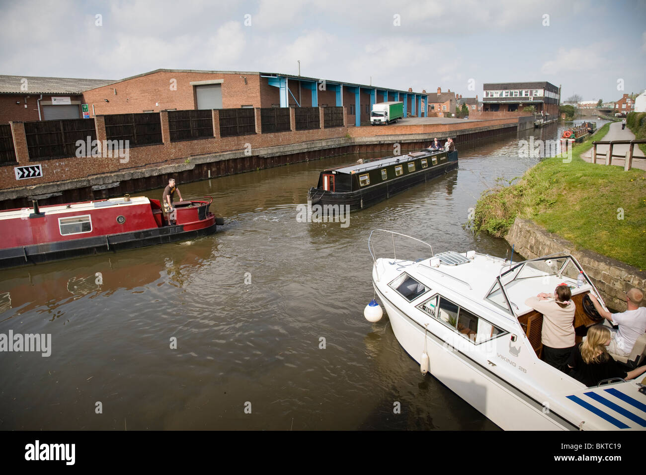 Three boats attempt to navigate around each other at a junction on the ...