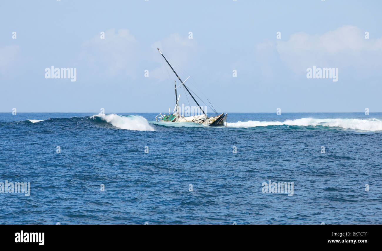 Wreck of a yacht on the rocks off the coast of Santa Cruz in the ...