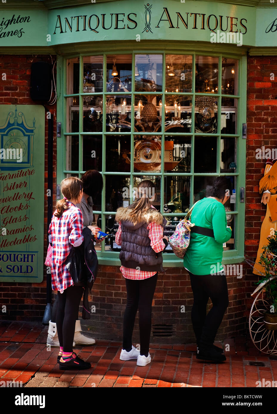 four shoppers outside an antique shop in the Lanes shopping area ...