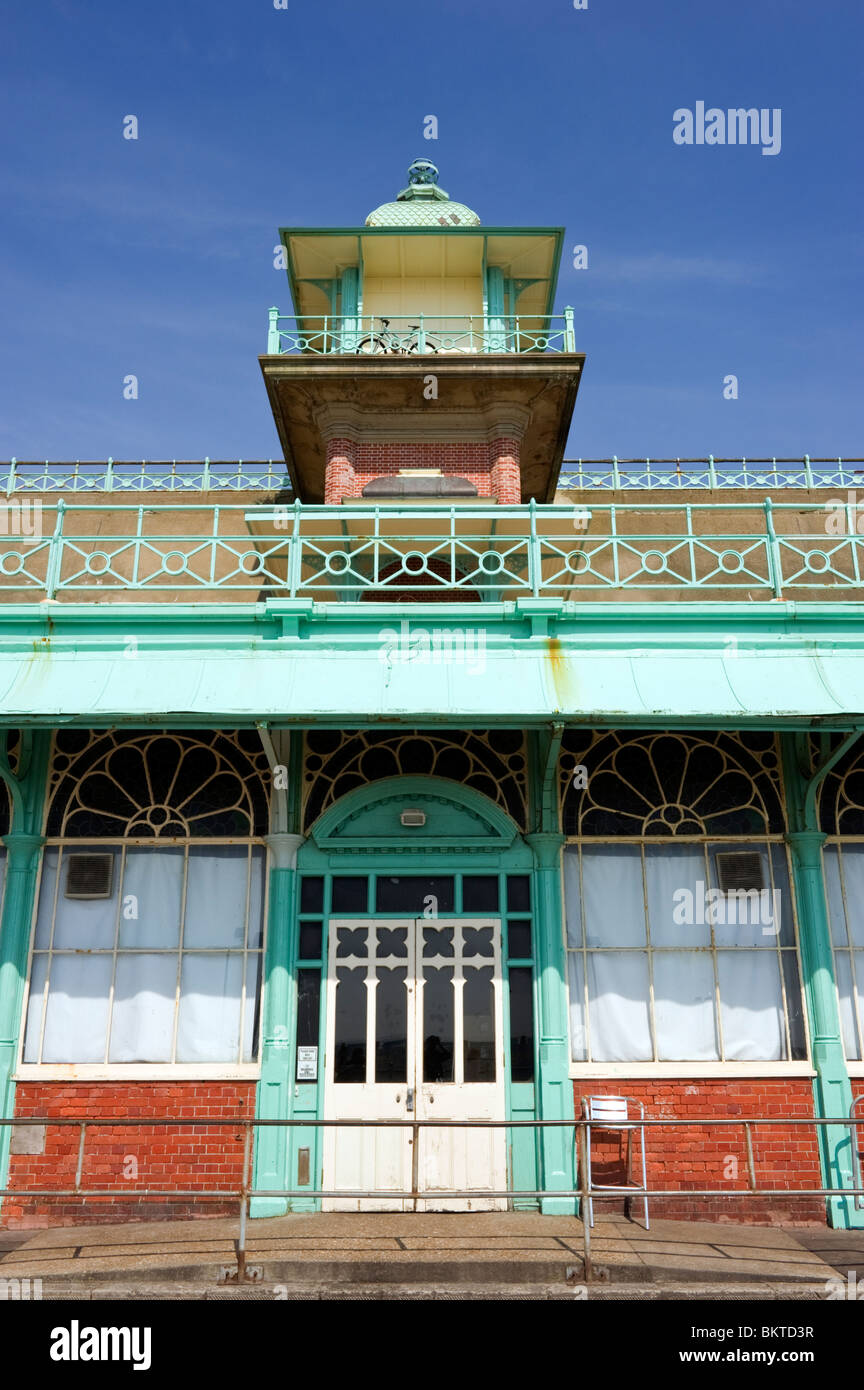 A historical Victorian building on Brighton seafront under a clear blue ...