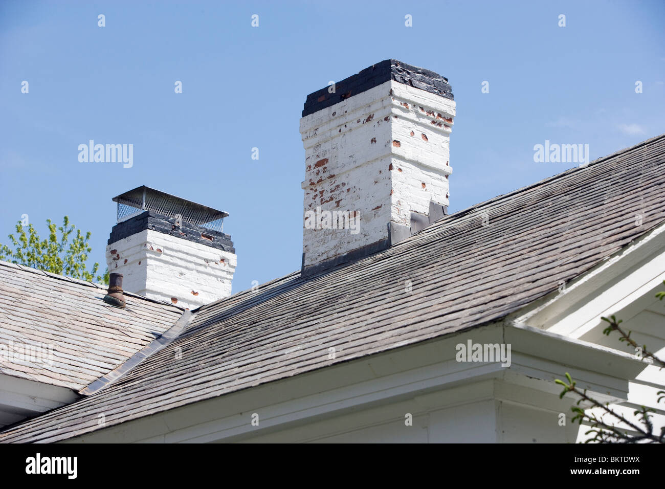 18th century Vermont home showing a black stripe on a white chimney ...