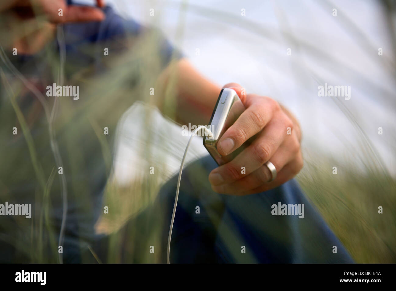 man using ipod Stock Photo - Alamy