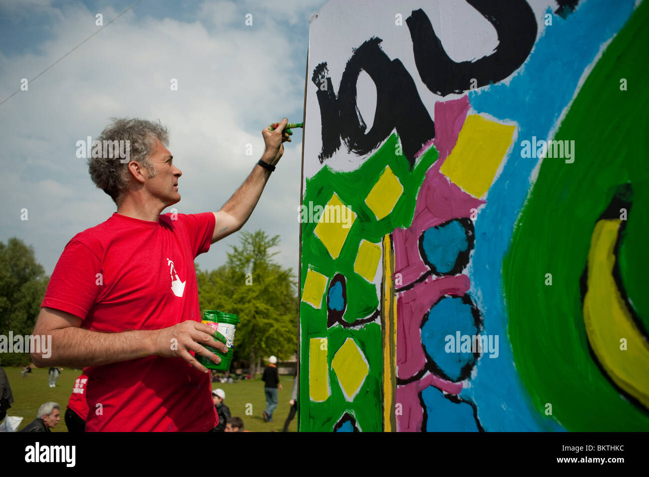 Celebration of World "Fair Trade" Day, with Man Painting Wall, on Lawn ...