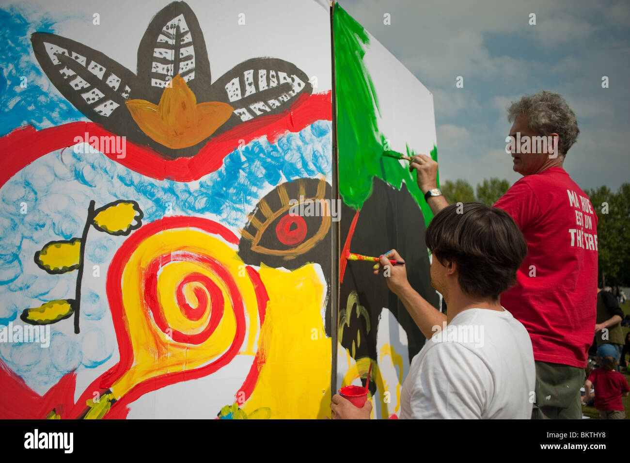 Celebration of World "Fair Trade" Day, with Men Painting Wall on Lawn ...