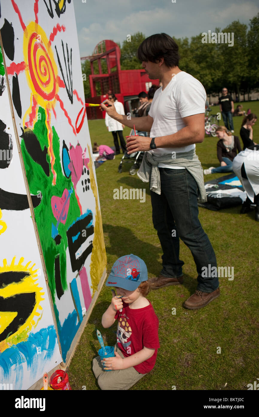Celebration of World "Fair Trade" Day, with Man Painting Wall, on Lawn ...