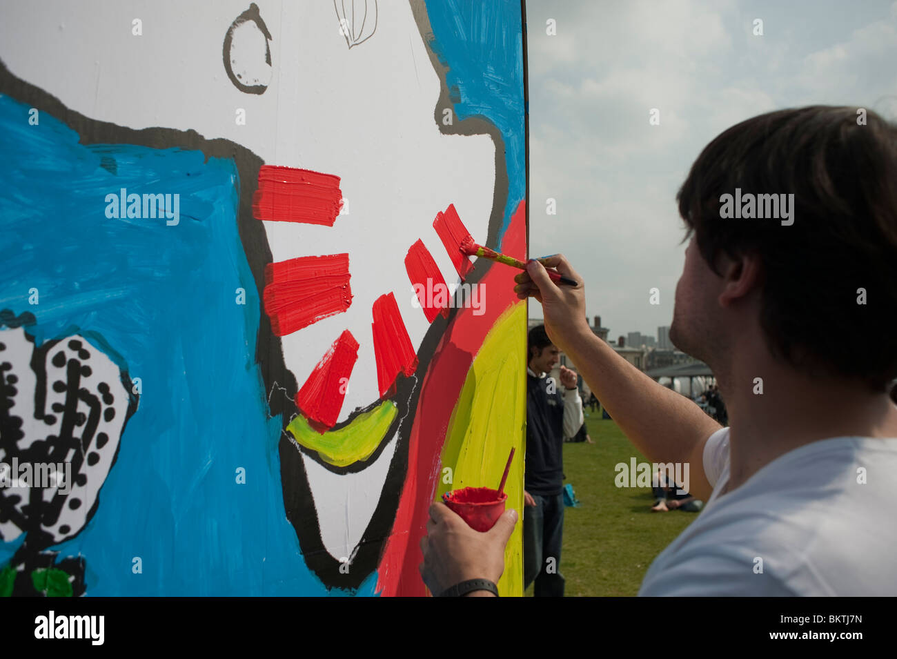 Celebration of World "Fair Trade" Day, with Man painting Wall, on Lawn ...