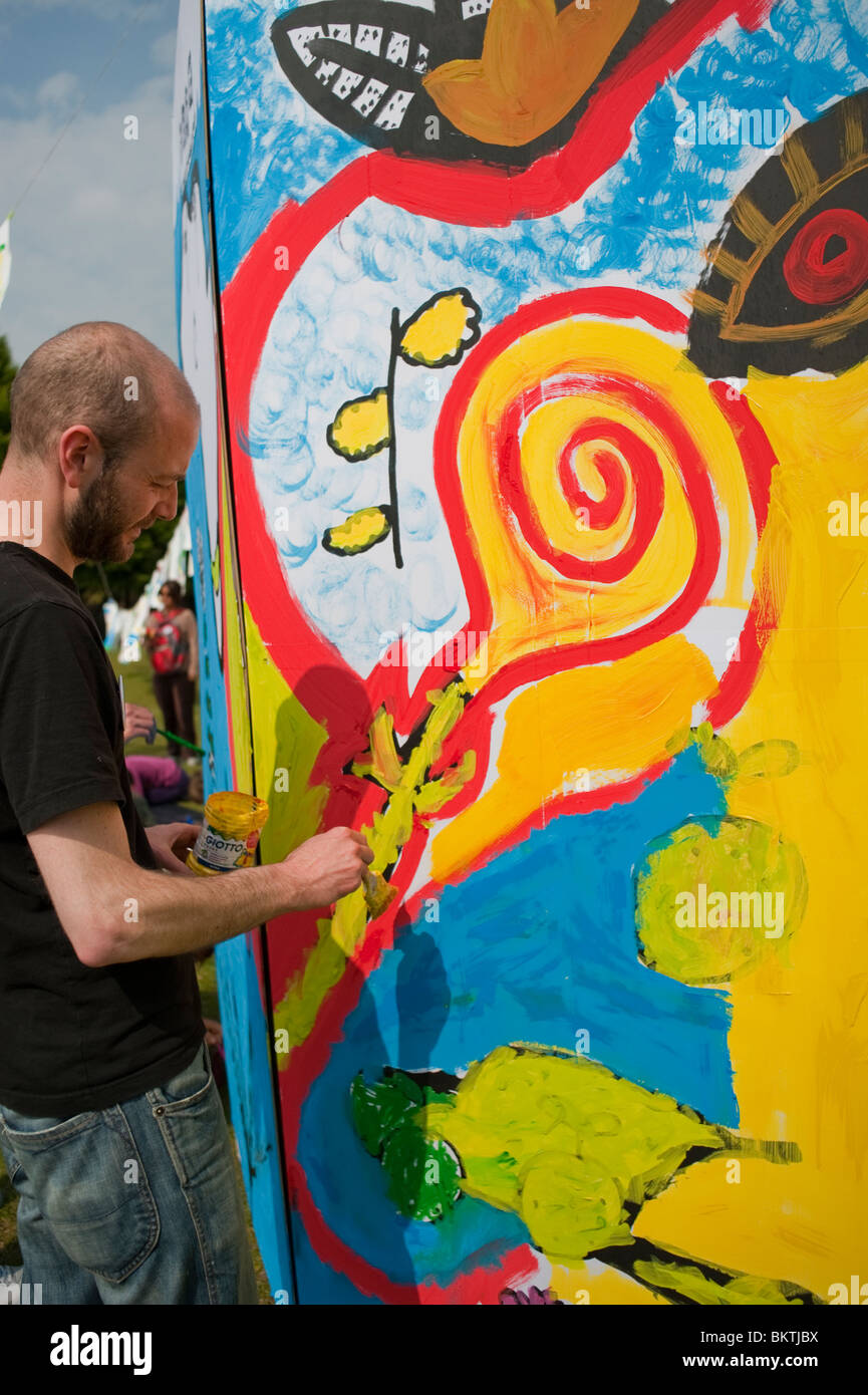 Celebration of World "Fair Trade" Day, with Man Painting Wall, on Lawn ...