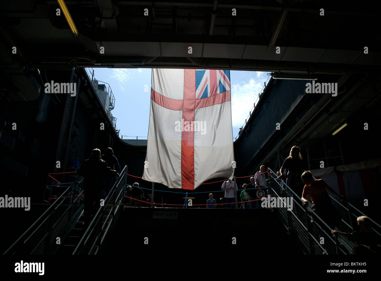 Large ship's flag viewed from below decks of the Aircraft Carrier HMS ...