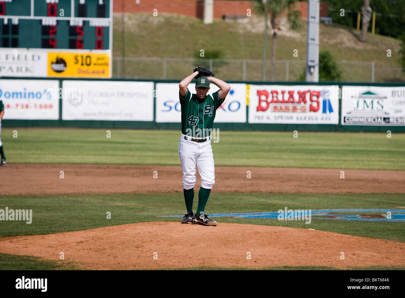 Baseball pitcher winding up for a pitch Stock Photo - Alamy