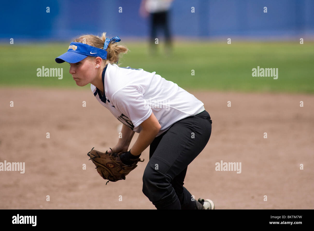 Softball player ready for ball to be hit to her Stock Photo - Alamy