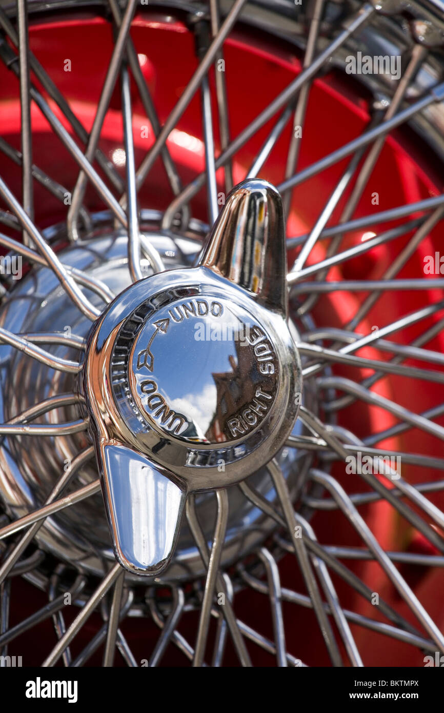Details of a high chrome wire spare wheel on the back of a Morgan style ...