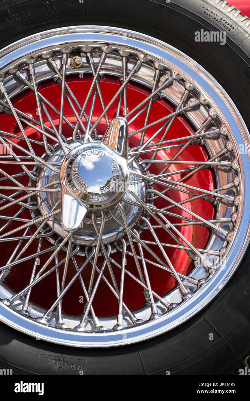 Details of a high chrome wire spare wheel on the back of a Morgan style ...