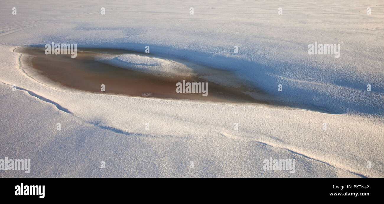 pool of melted water and ice on solid sea ice , Finland Stock Photo - Alamy