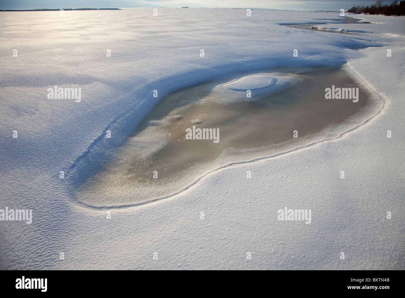 Pool of melted water and ice on solid sea ice , Finland Stock Photo - Alamy