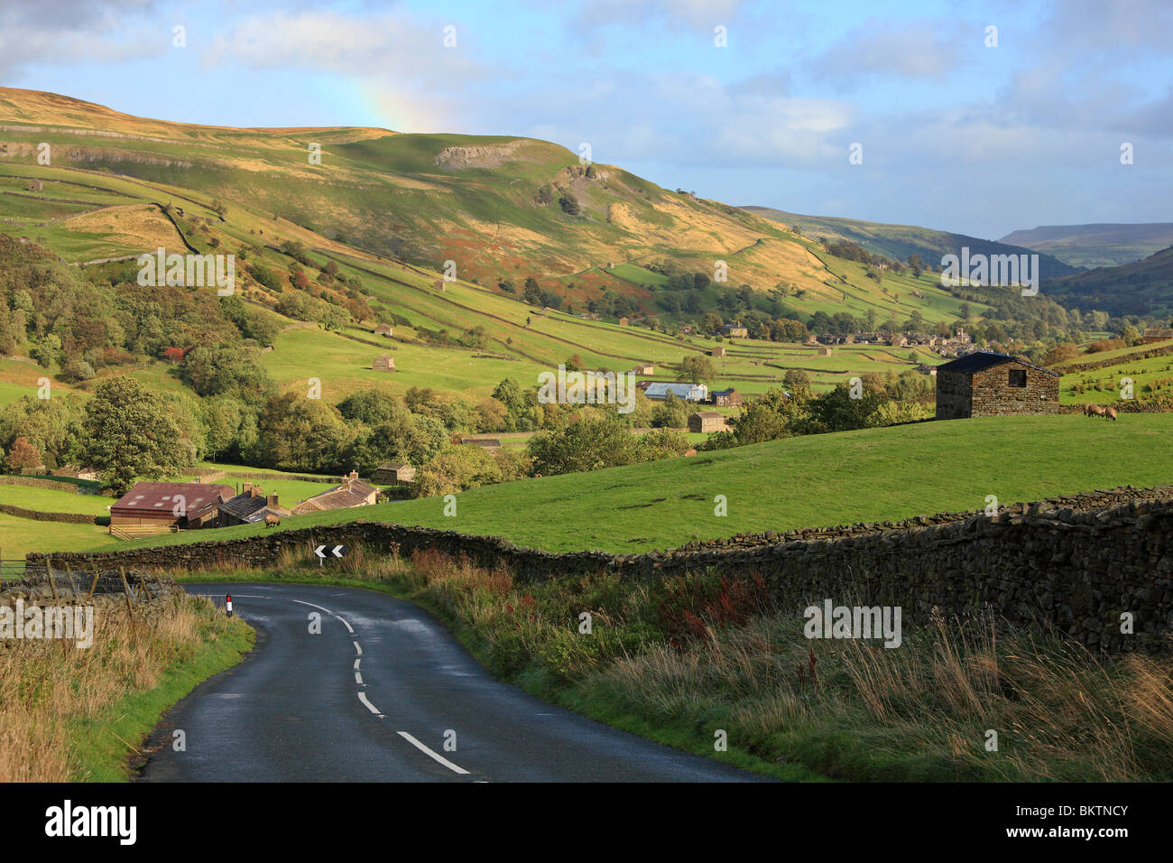 A faint rainbow over the barns of Swaledale on an autumn afternoon ...