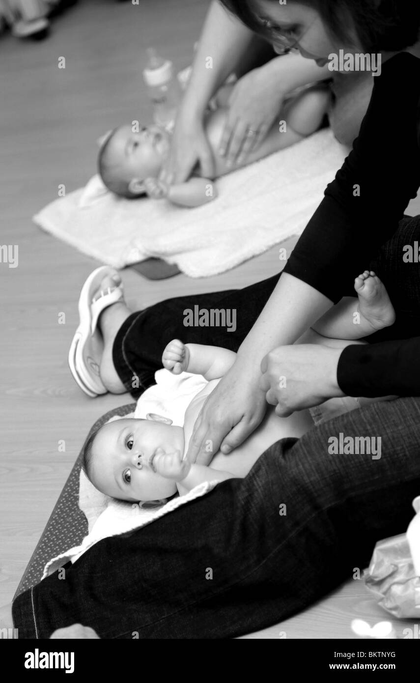 Infant massage Black and White Stock Photos & Images - Alamy