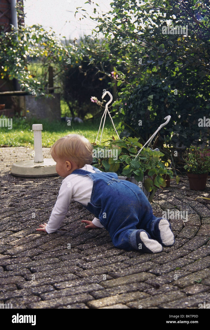 Toddler crawling outside yard hi-res stock photography and images - Alamy