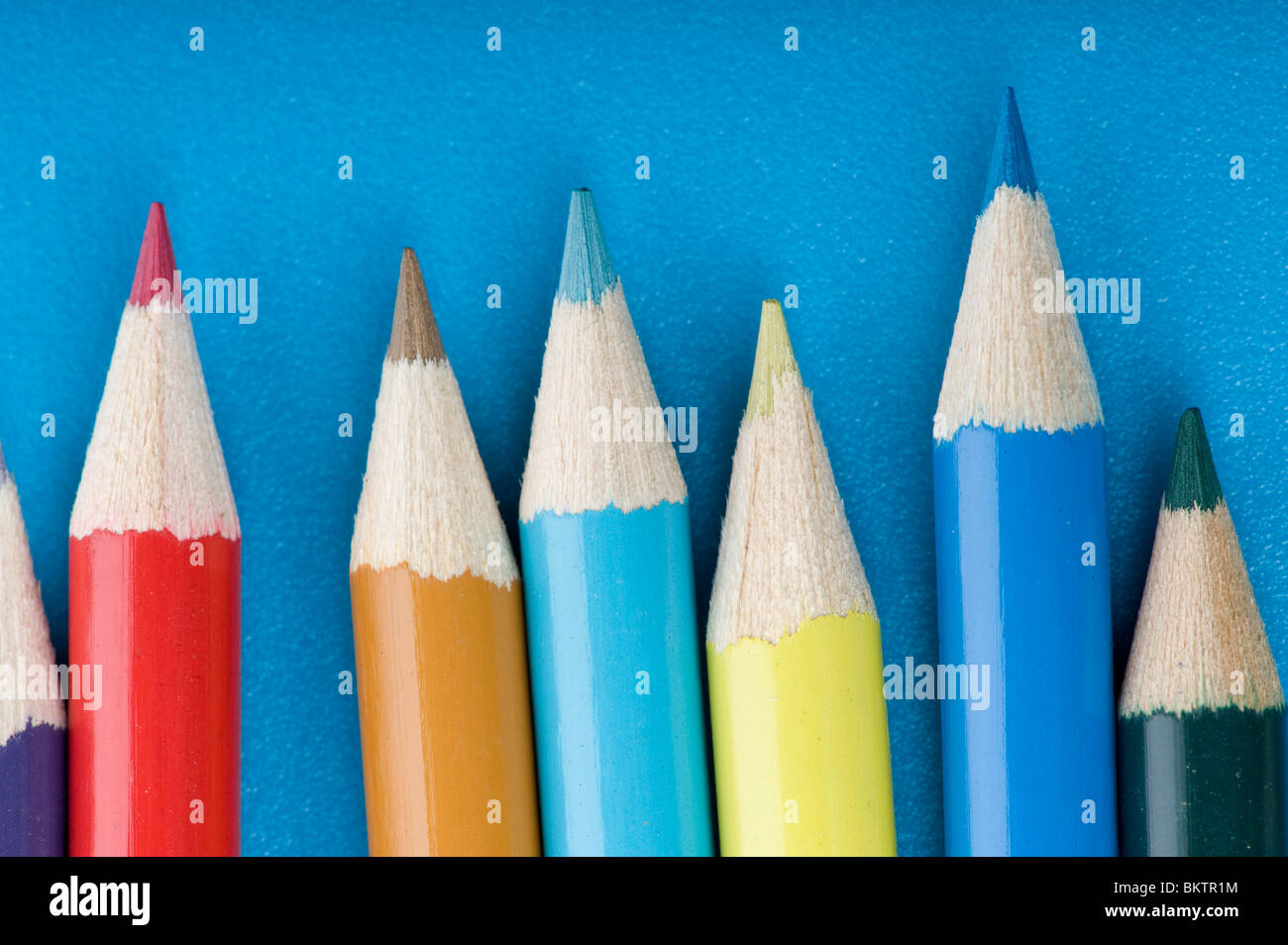 object on blue - Colored crayon close up Stock Photo - Alamy