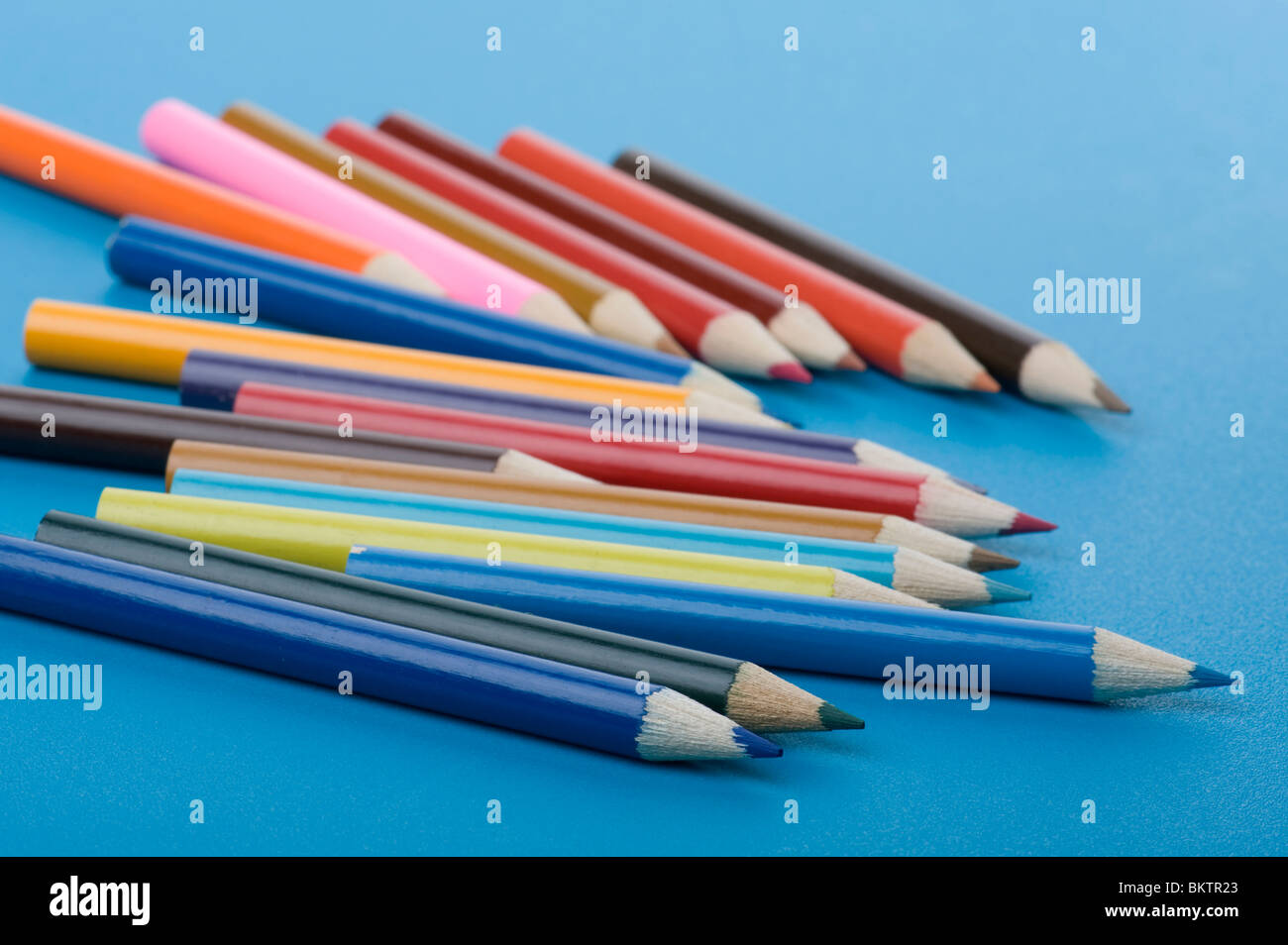object on blue - Colored crayon close up Stock Photo - Alamy