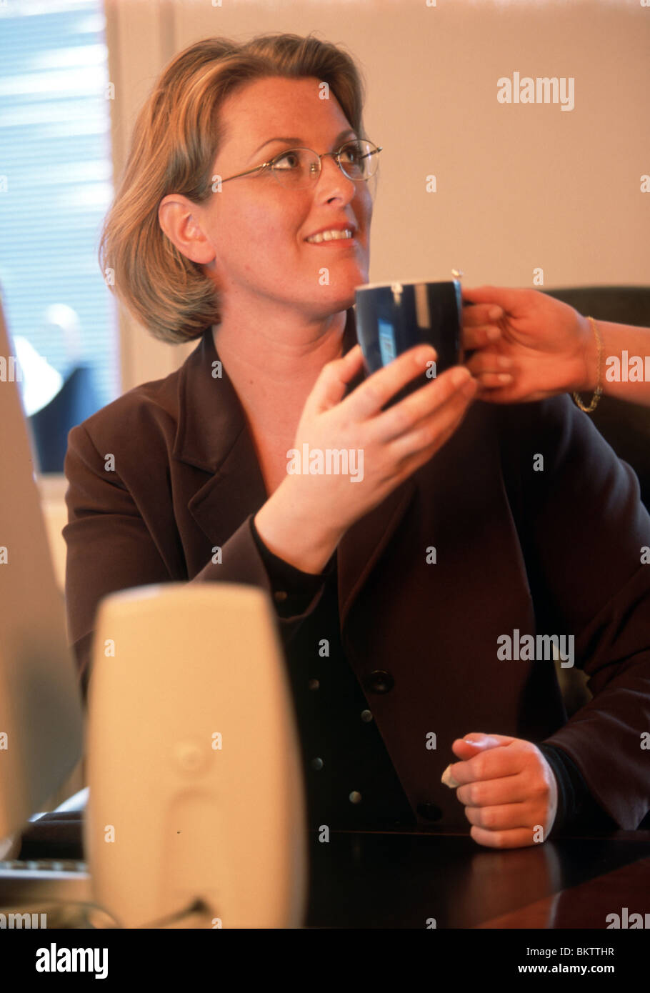 Coffee at desk at work Stock Photo - Alamy