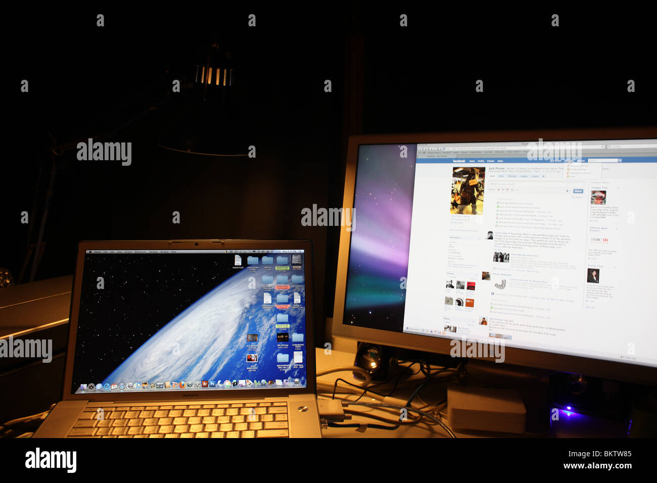 Mac Computer screens on desktop Stock Photo - Alamy