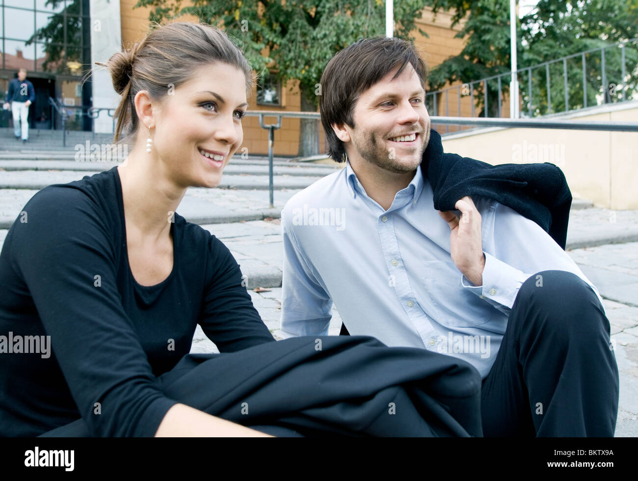Two people sitting on stairs hi-res stock photography and images - Alamy