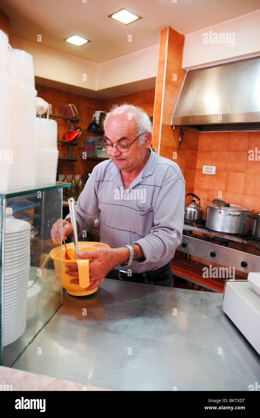 Israel, Haifa, Man makes Falafel - Deep fried Ground chickpeas the ...