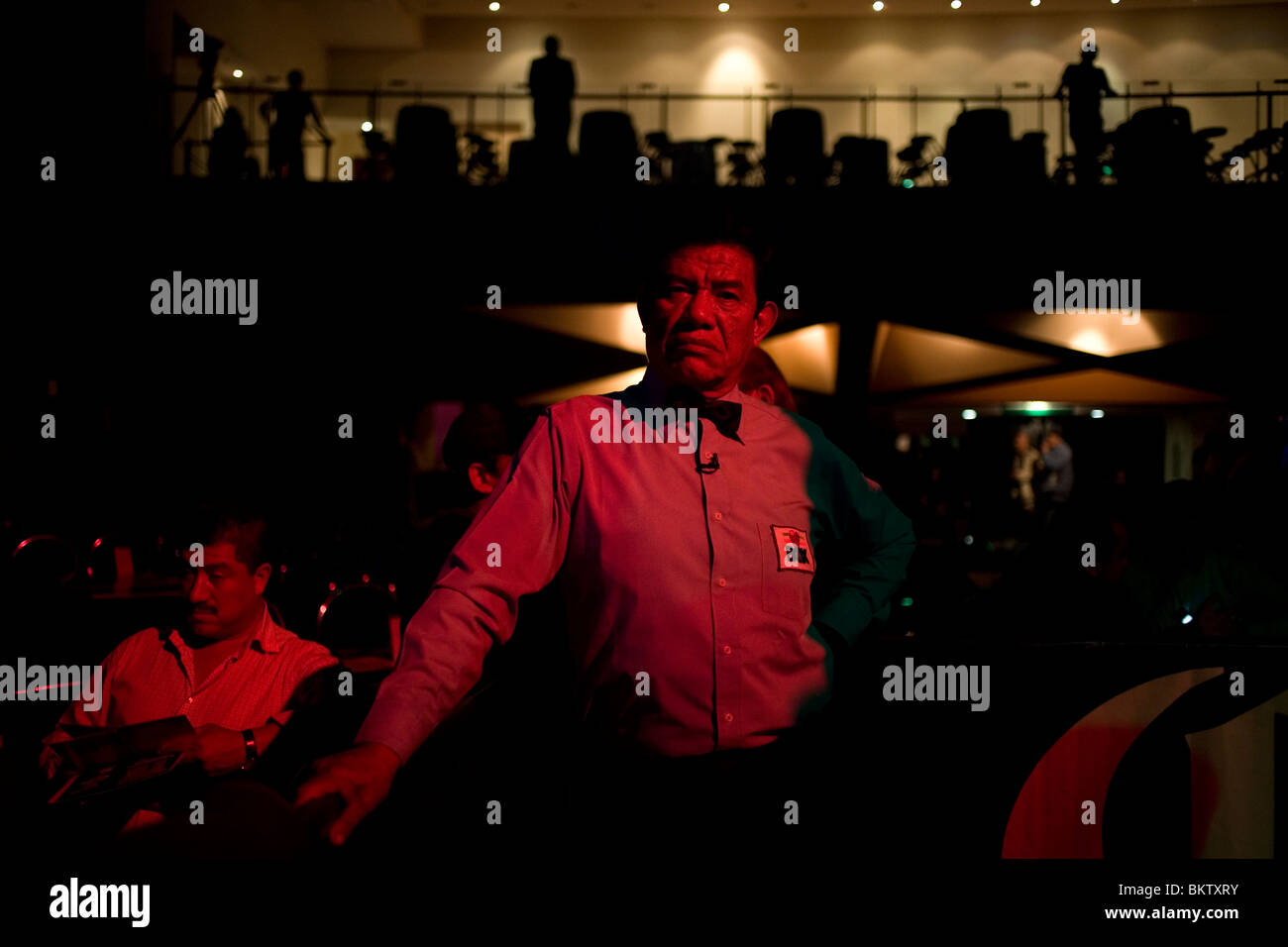 A boxing referee waits for the boxers before a bout Mexico City ...
