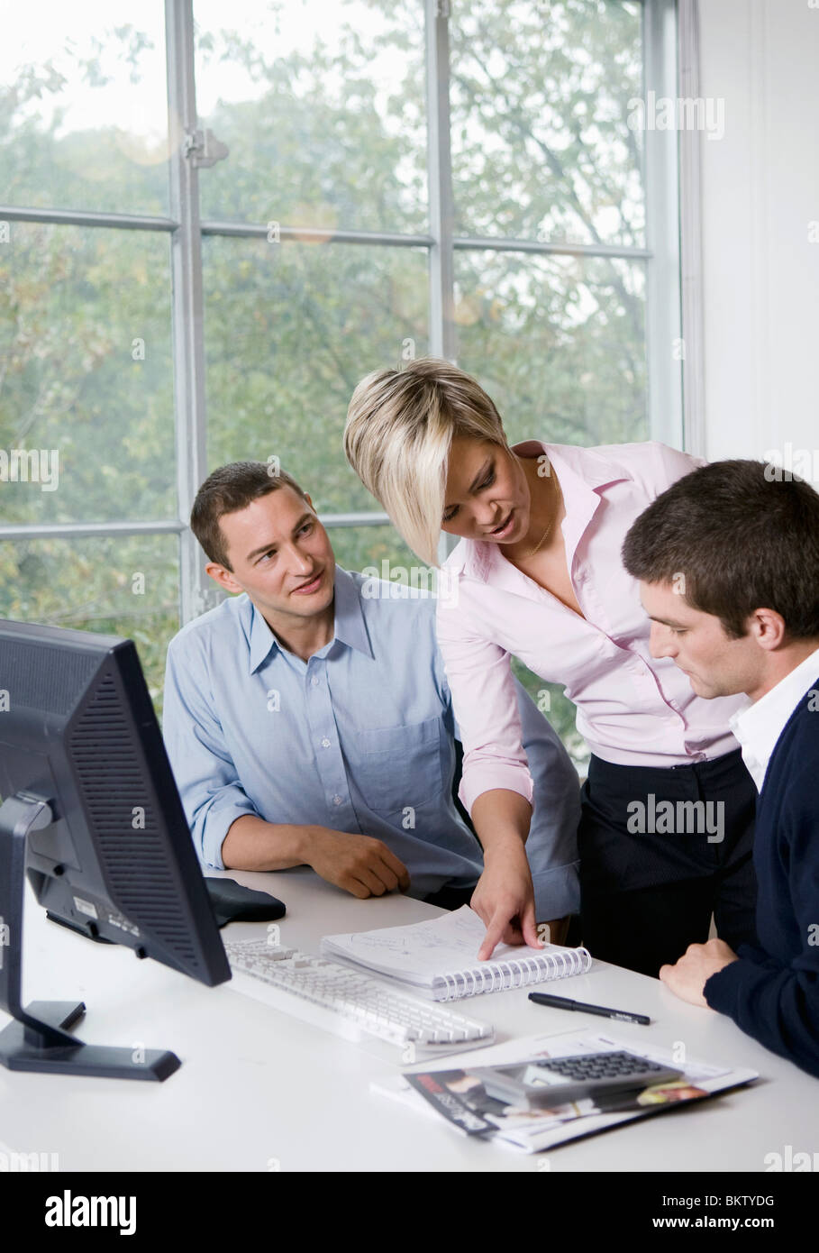 Three people at work Stock Photo - Alamy