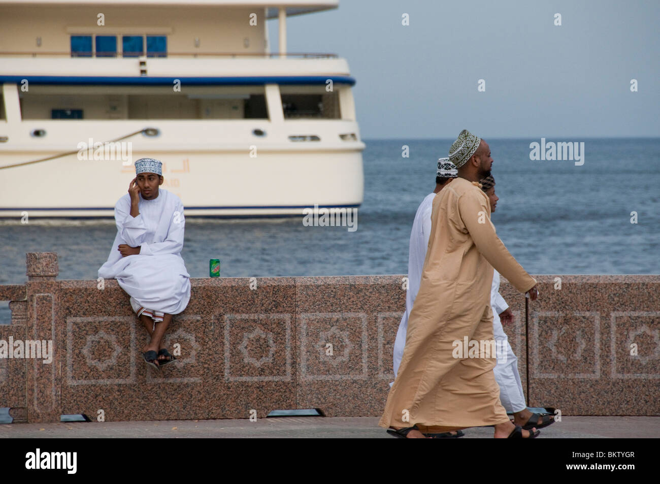 Local people walking waterfront Mutrah Muscat Oman Stock Photo - Alamy