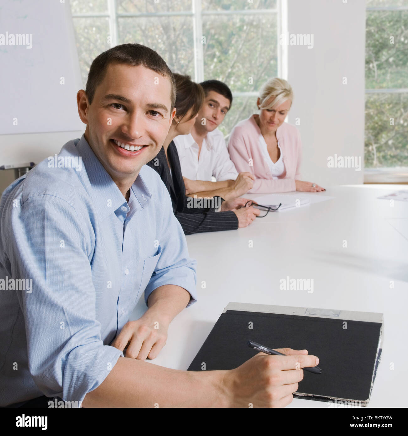 Team four businessmen conference table hi-res stock photography and ...