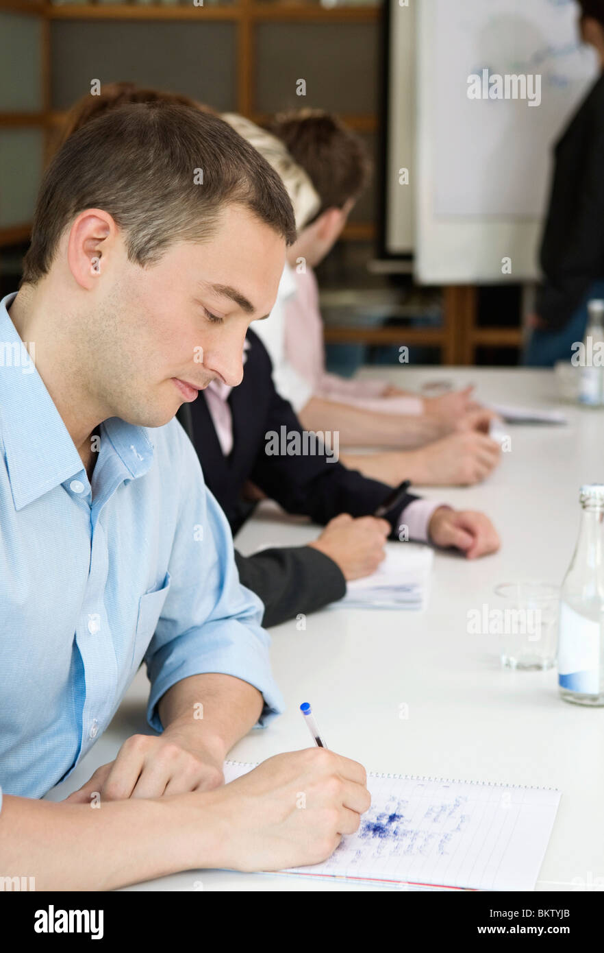 Businessman taking notes Stock Photo - Alamy